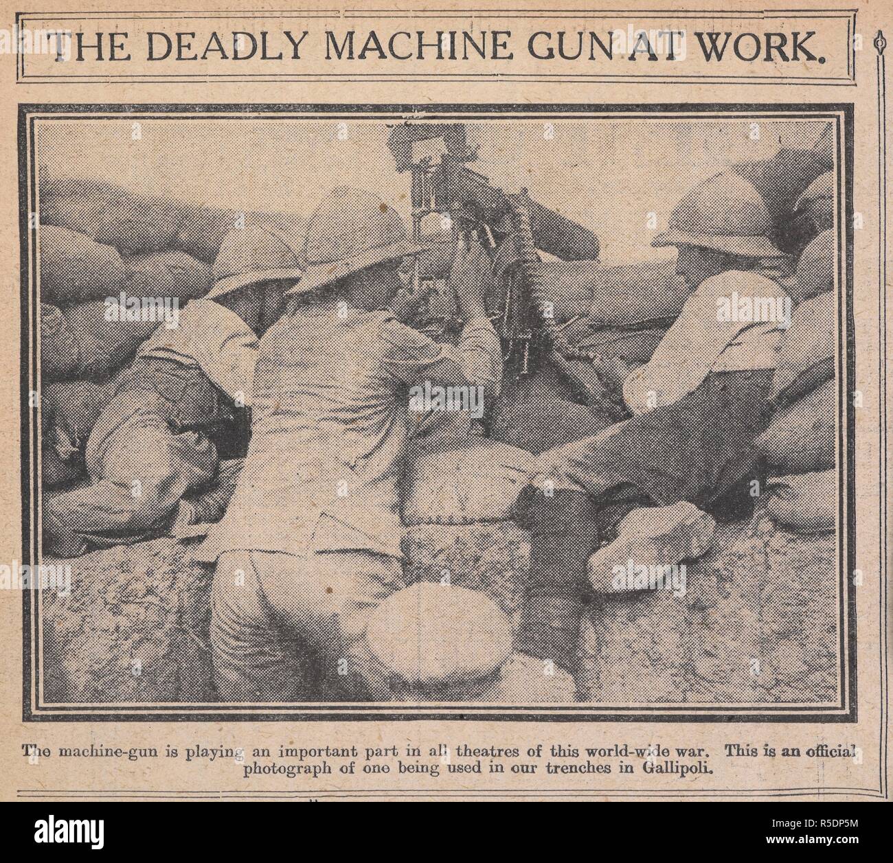 'The deadly machine gun at work'. A photograph of soldiers using a ...