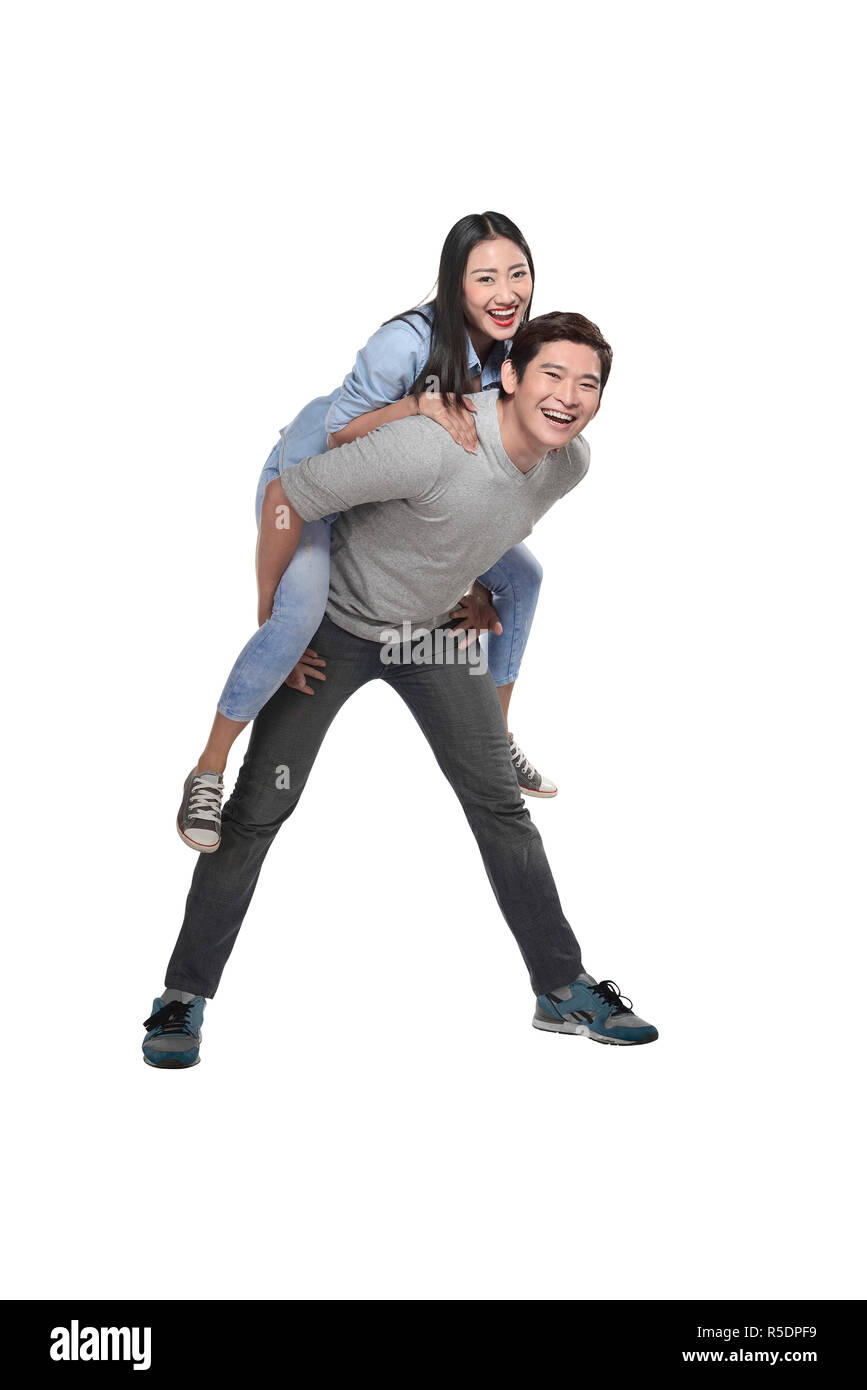 Young man carrying his laughing partner Stock Photo - Alamy