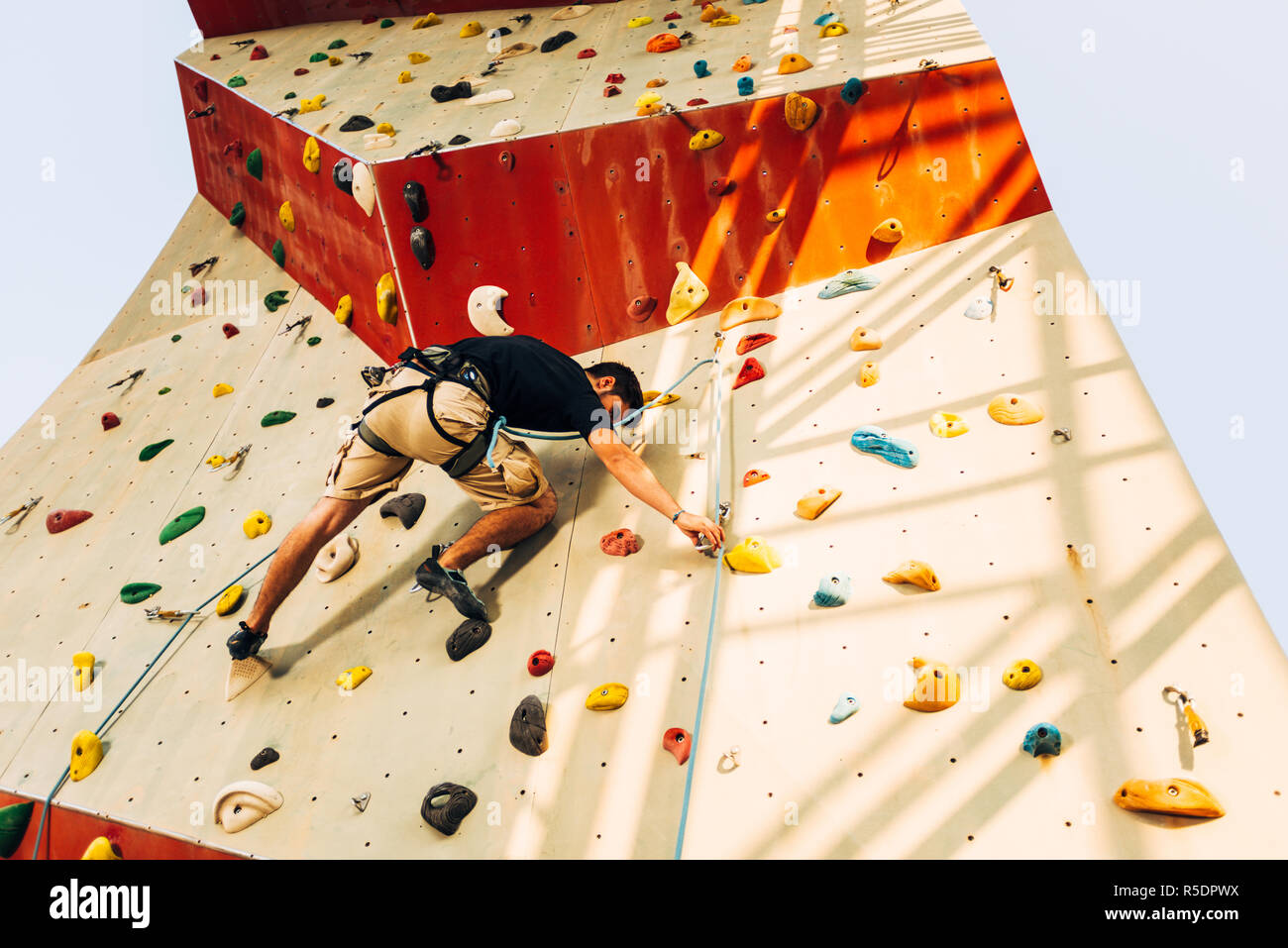 Active lifestyle and bouldering climbing, reaching the top concept ...