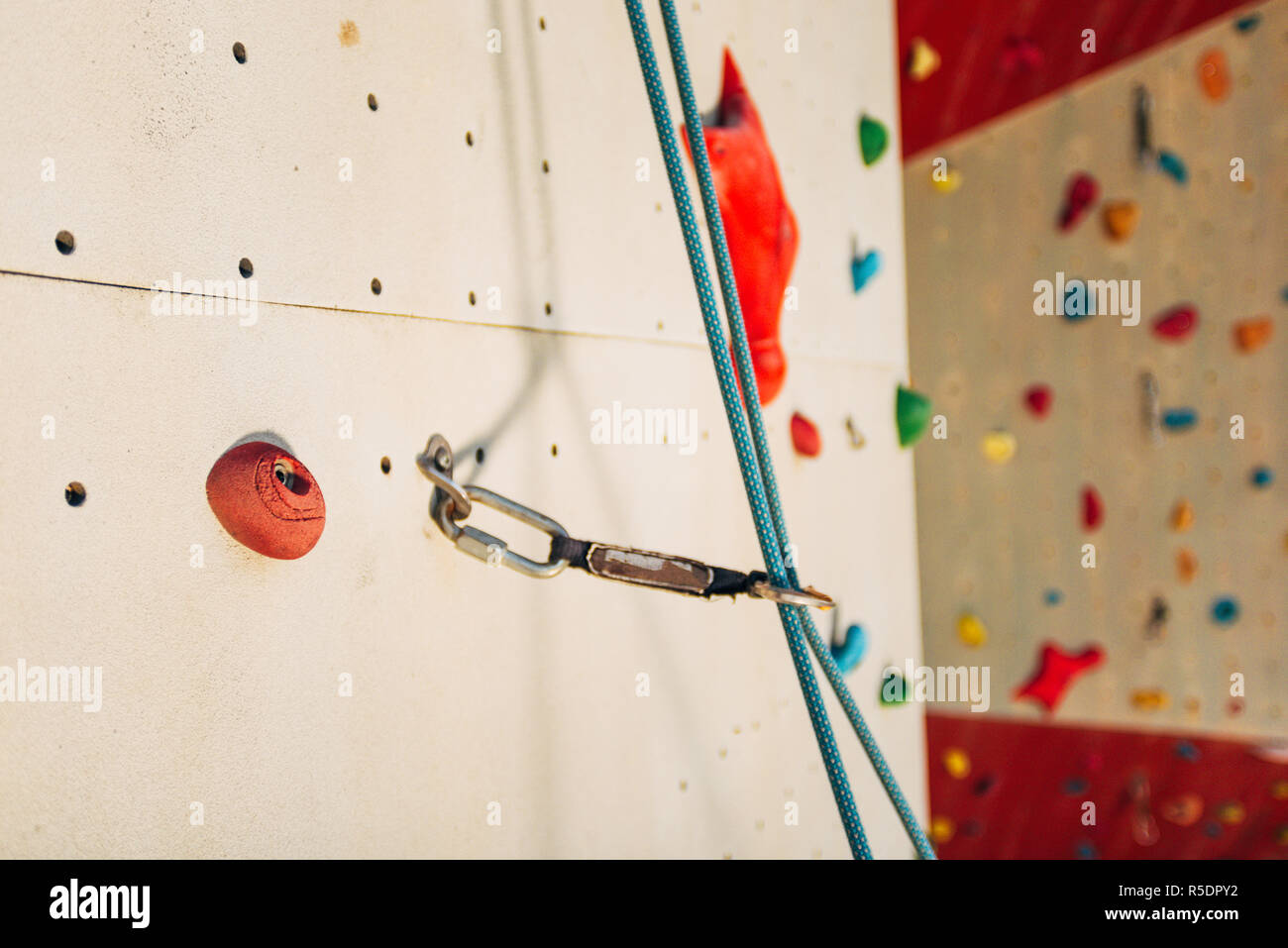 Outdoor rock climbing wall in a sport facility Stock Photo - Alamy