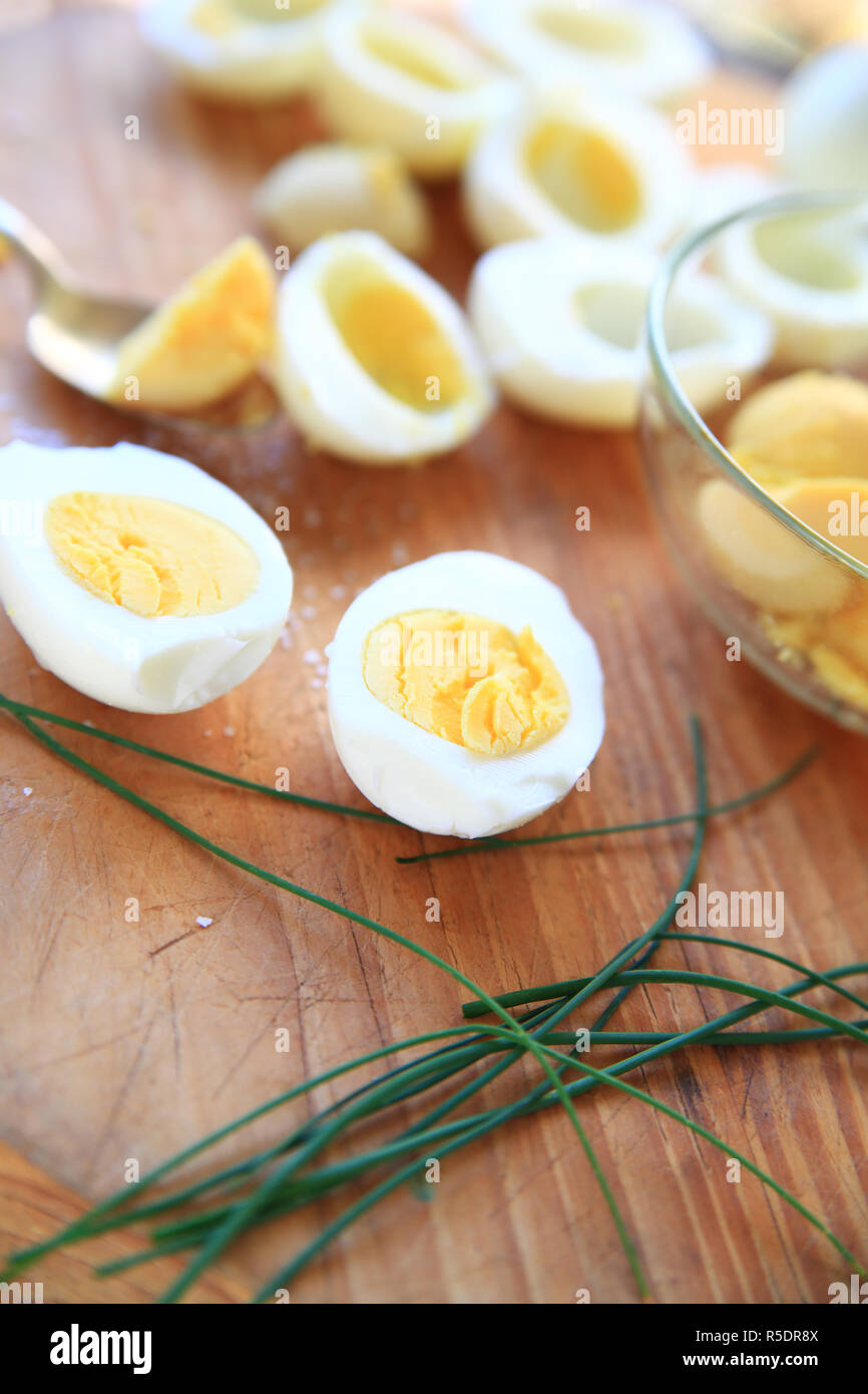 Boiled eggs with chives Stock Photo - Alamy