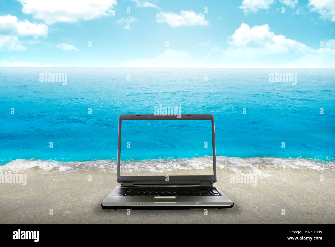 Computer laptop on the beach Stock Photo - Alamy
