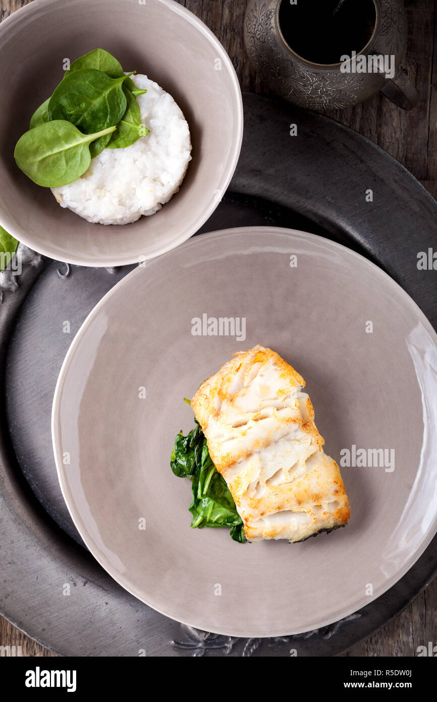 Fried cod fillets and spinach Stock Photo - Alamy
