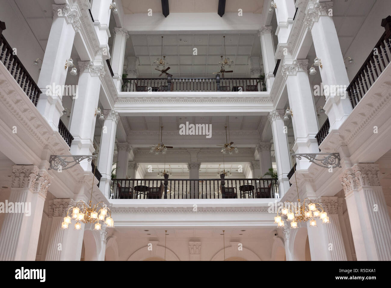 Atrium of Raffles Hotel, Singapore Stock Photo - Alamy
