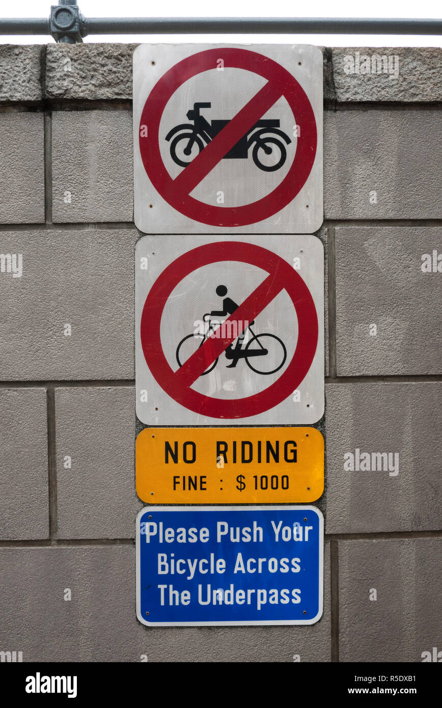 'No riding' signs, Singapore Stock Photo - Alamy