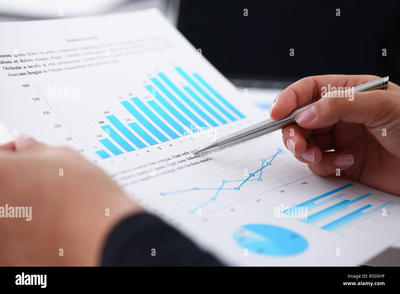 businesswoman study documents in office closeup Stock Photo - Alamy