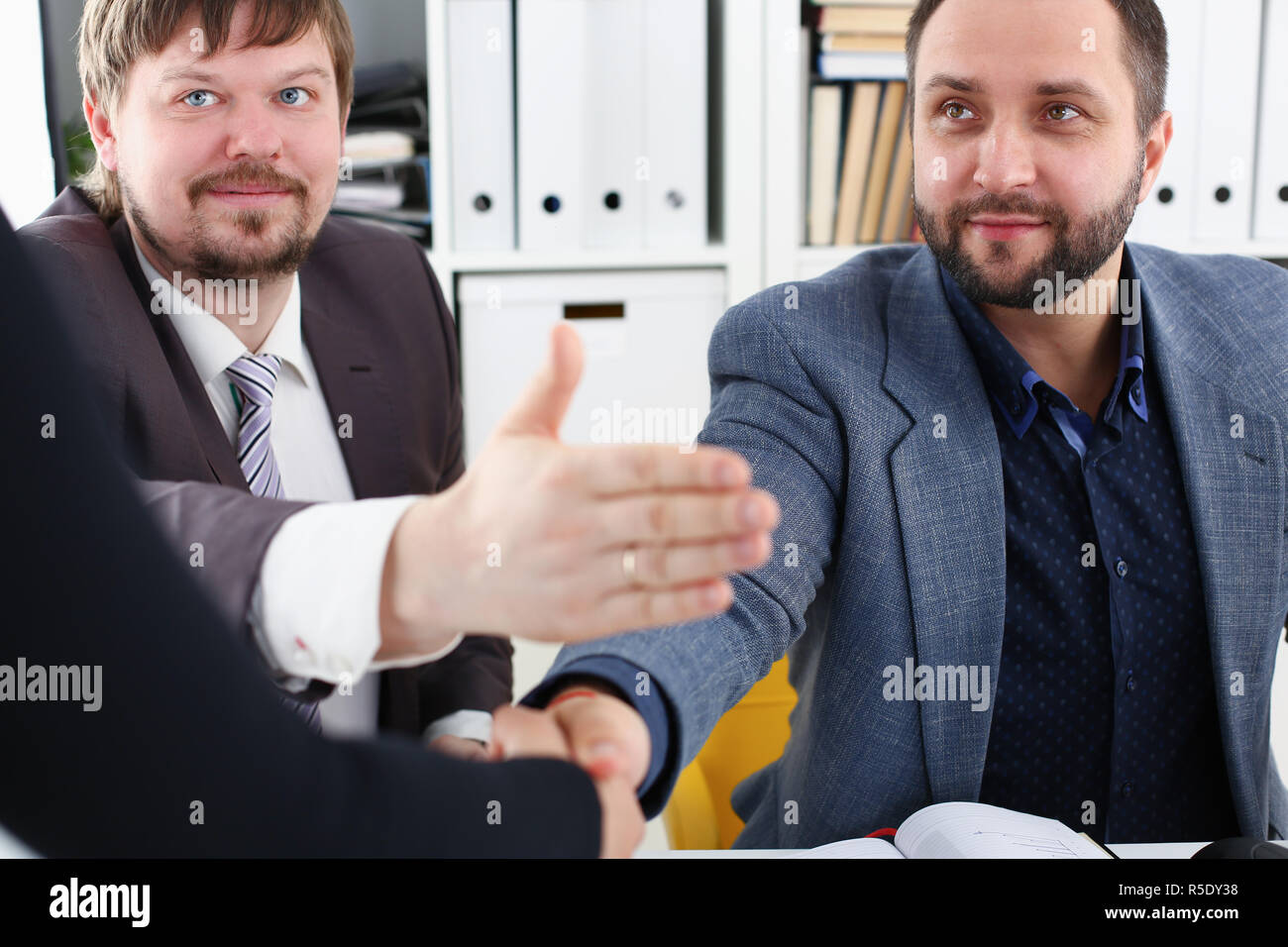 young happy businessmen have meeting in office argue with each other ...