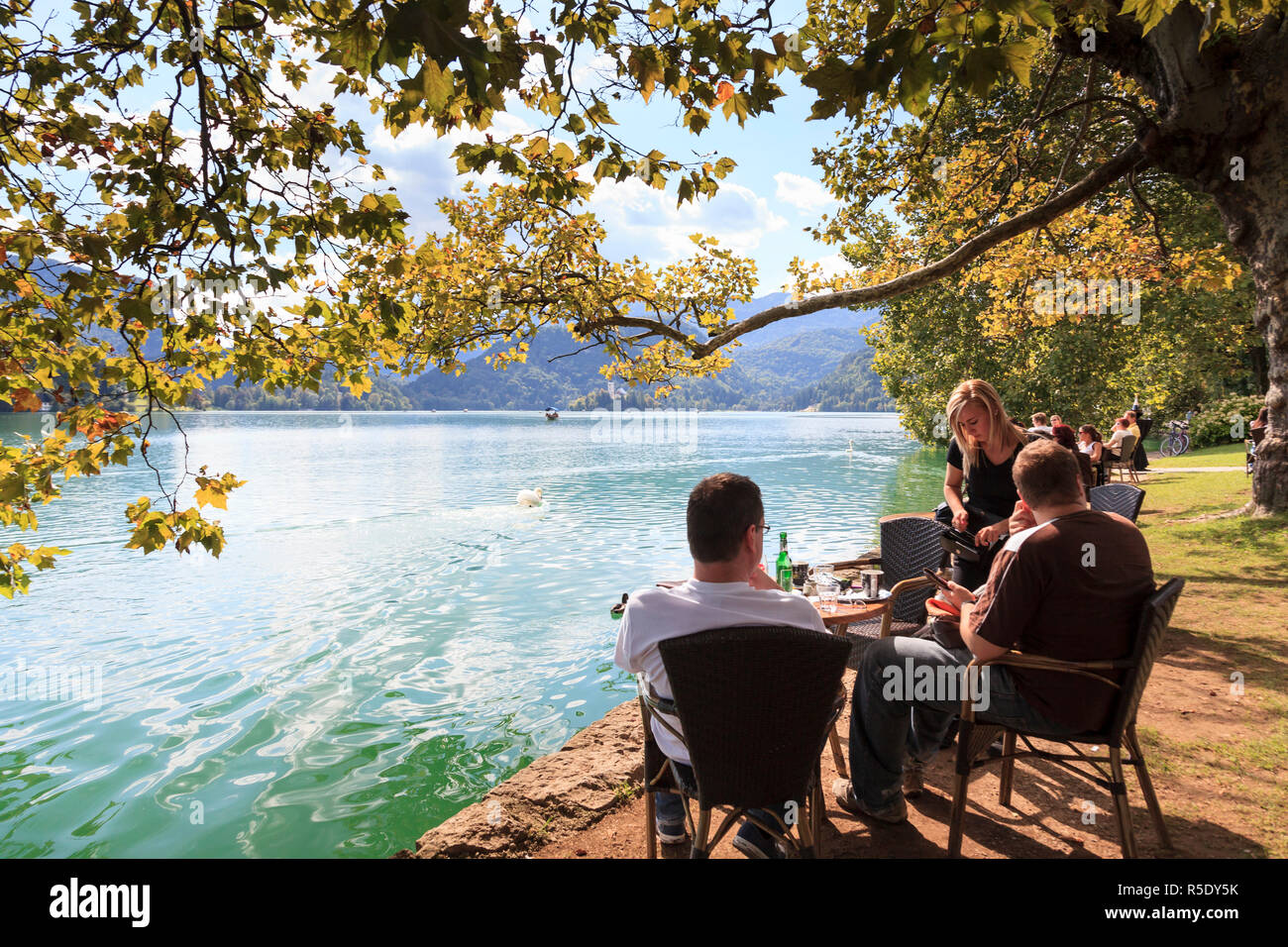 Slovenia, Bled, Tourists at cafe on Lake Bled Stock Photo - Alamy