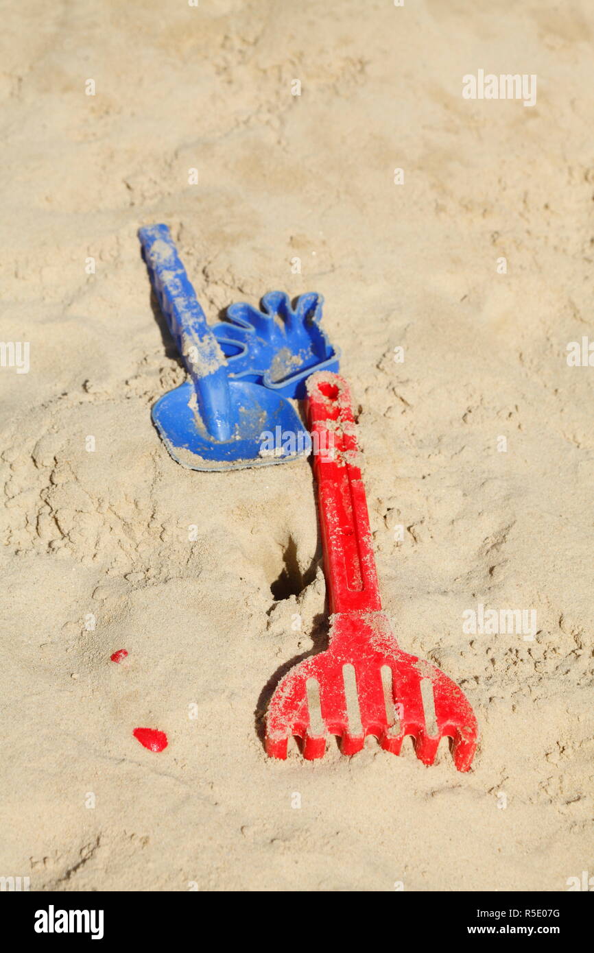 rake,plastic toy in a sandbox Stock Photo - Alamy