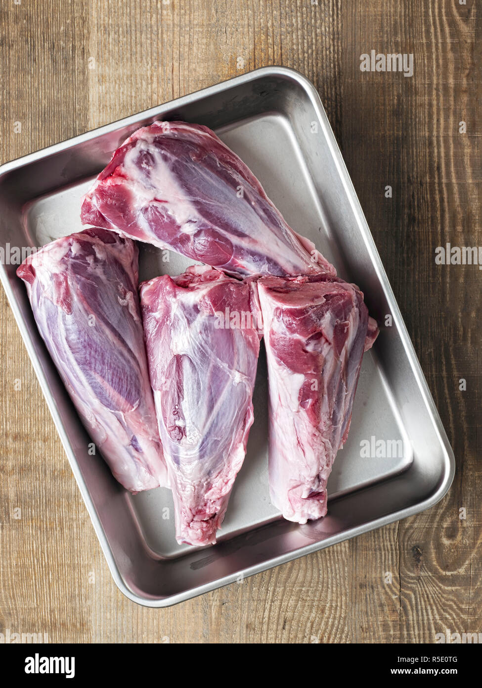 rustic uncooked lamb shank Stock Photo - Alamy