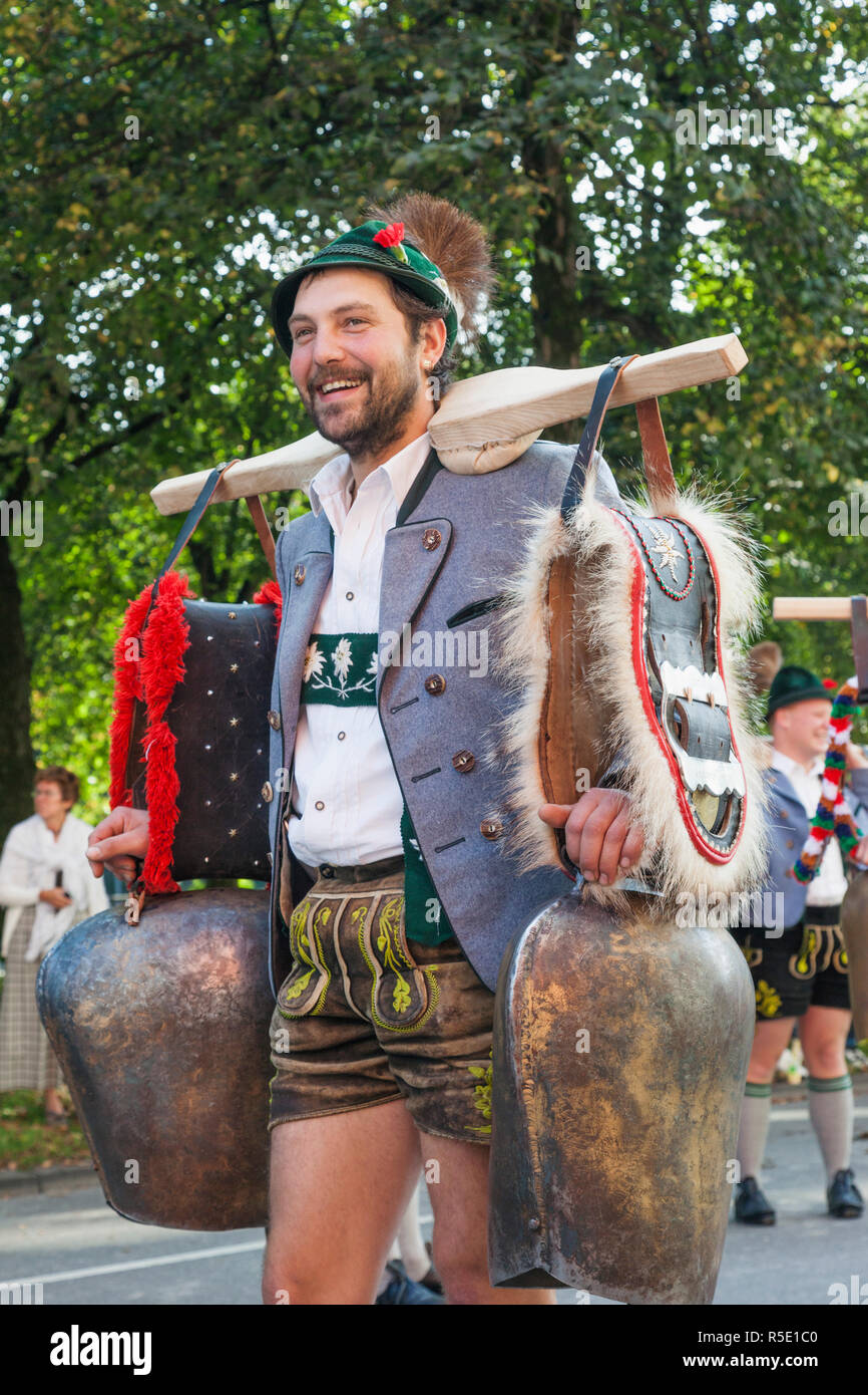Germany, Bavaria, Munich, Oktoberfest, Oktoberfest Parade, Man Carrying ...
