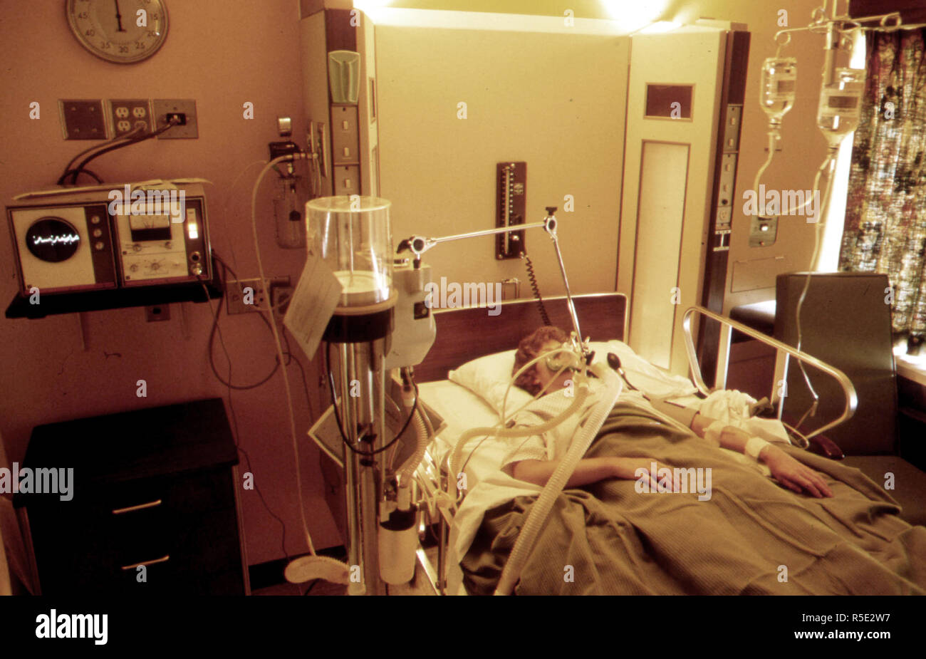 Man in intensive care unit in hospital ca. 1975 Stock Photo - Alamy