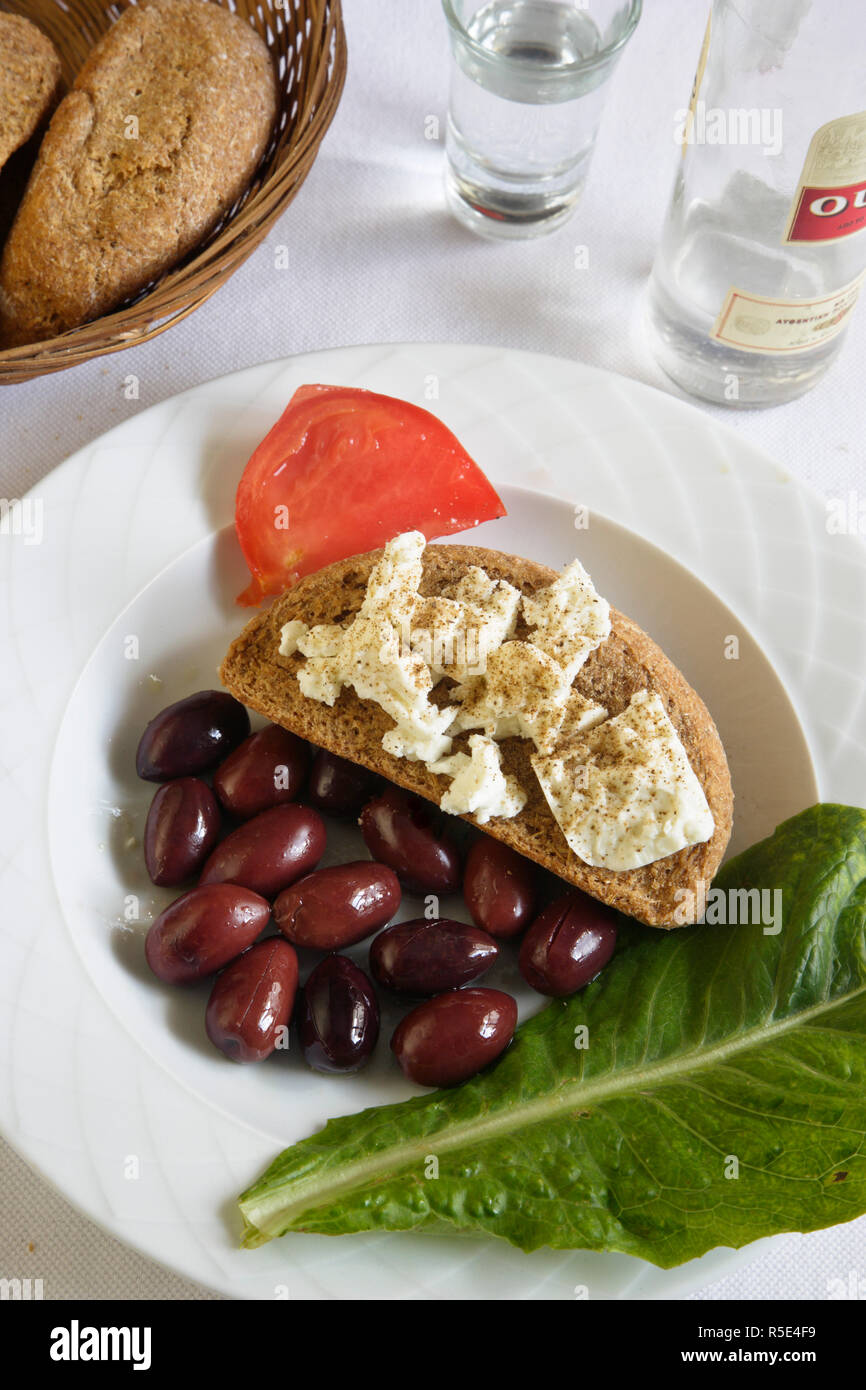 Greek Cuisine. Traditional Meze (Starter) Cretan Dakos with a glass of ...