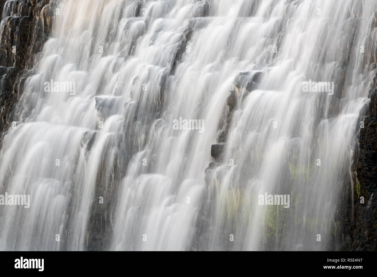 Whitewater cascades down a rocky cliff at Thunder Bay Falls near Galena ...