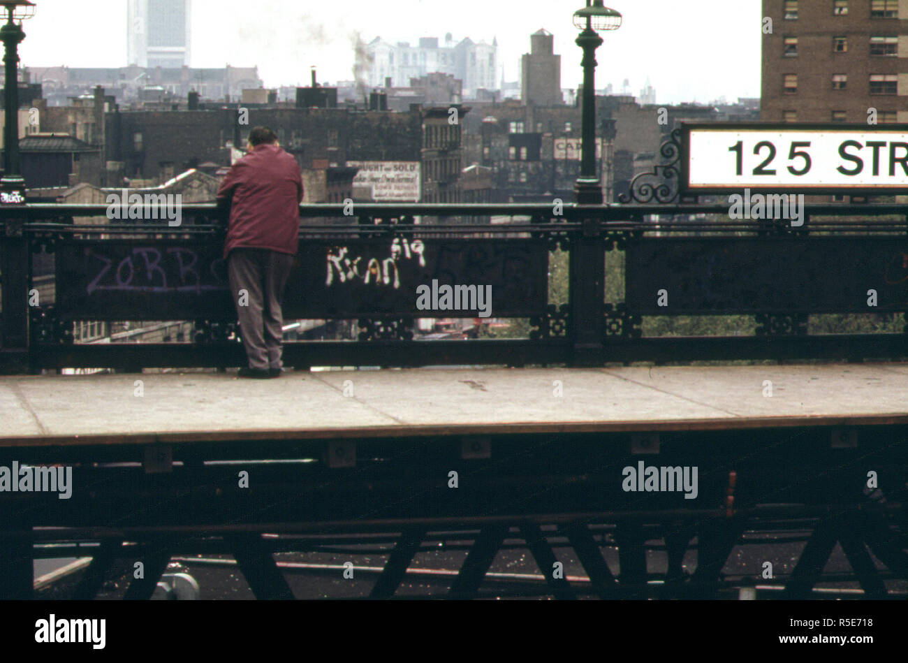 Man standing on 125th Street Elevated Train Platform. 05/1973 Stock ...