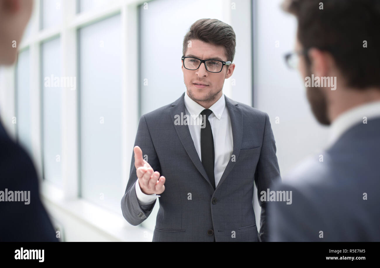 boss is discussing something with his employees Stock Photo - Alamy