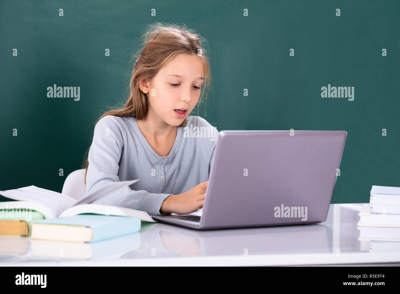 Open laptop books hi-res stock photography and images - Alamy