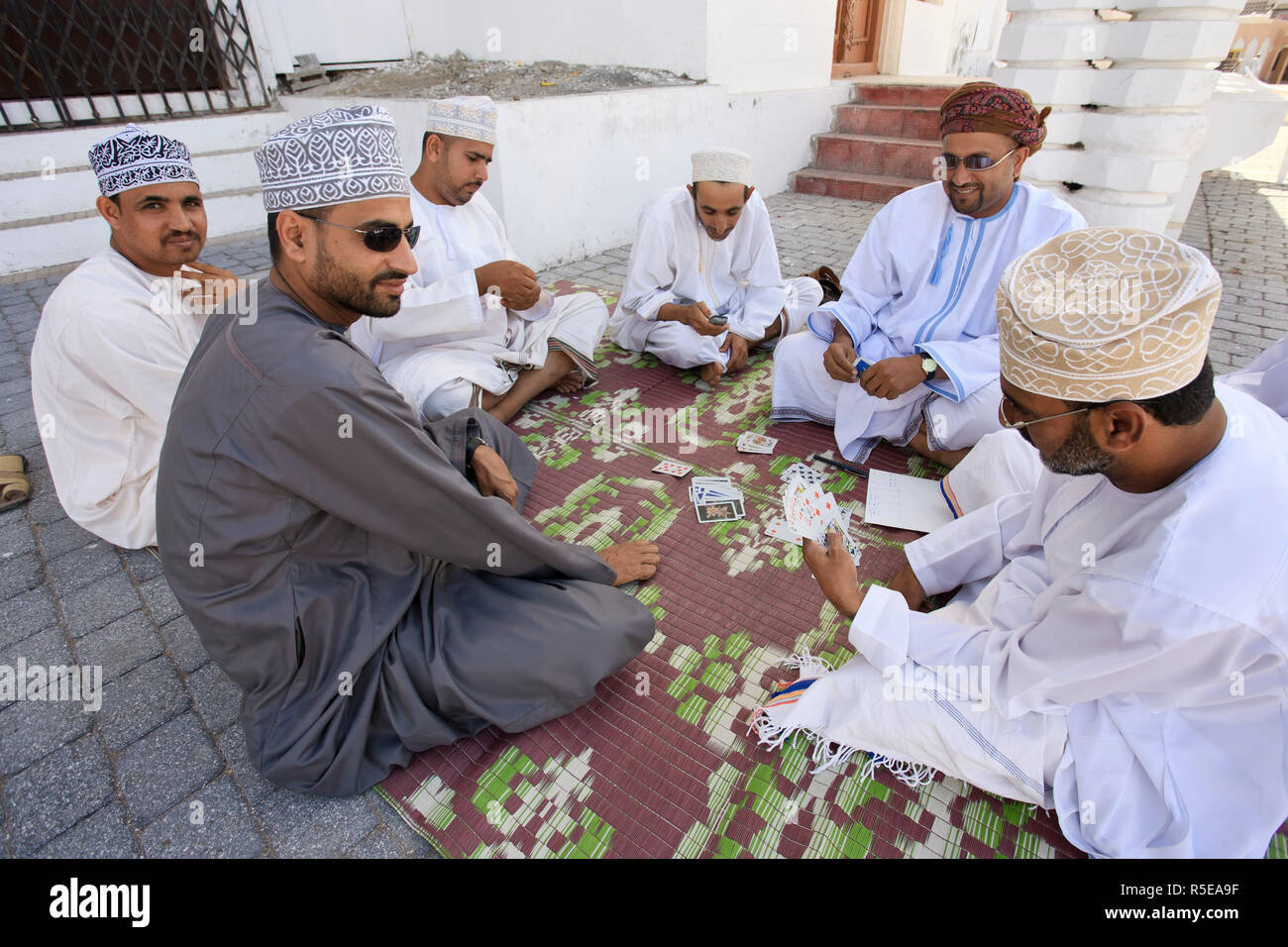 Oman, Muscat, Local people playing cards Stock Photo - Alamy