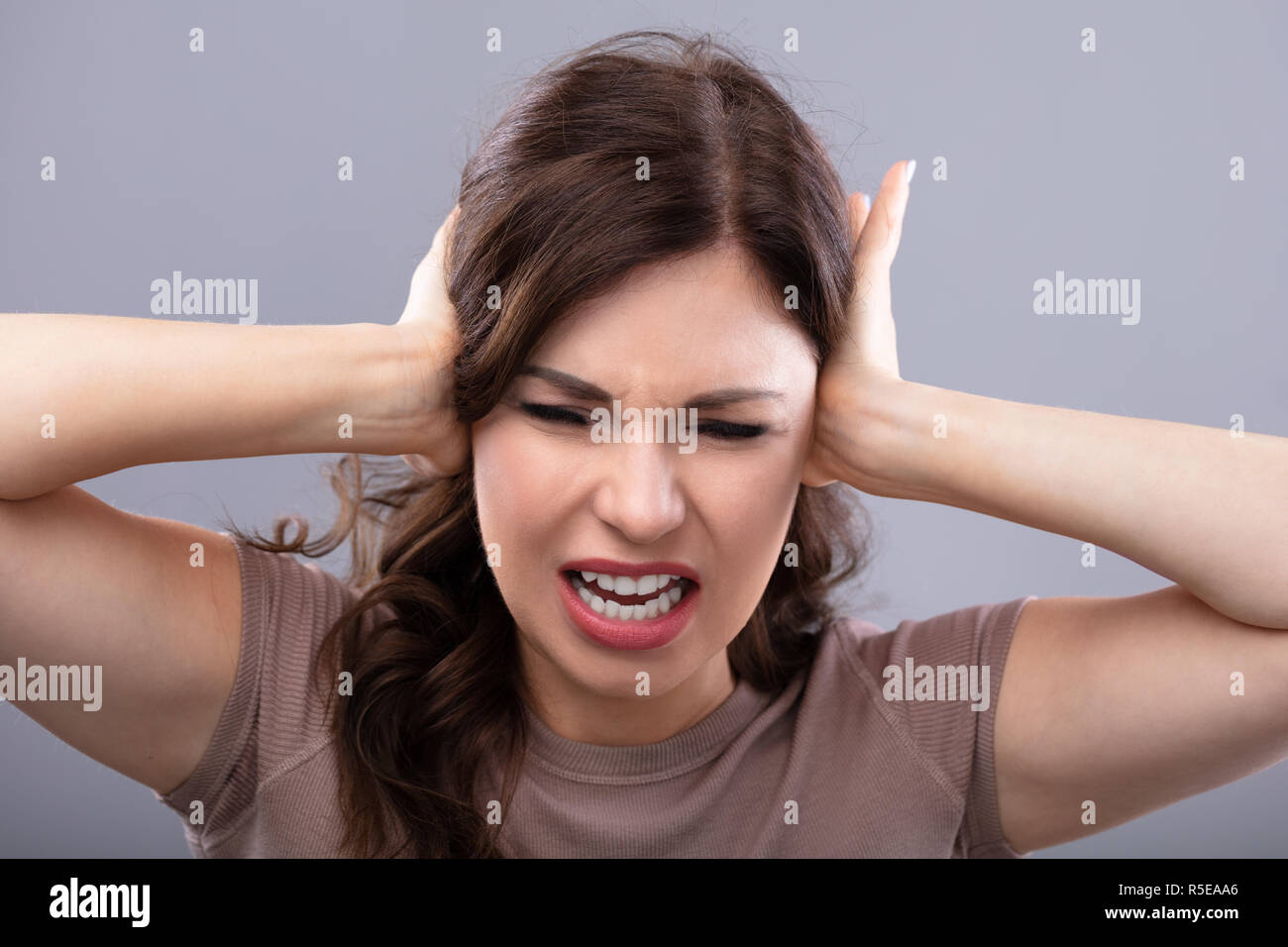 Shut out noise hi-res stock photography and images - Alamy Shut out noise hi-res stock photography and images - Alamy