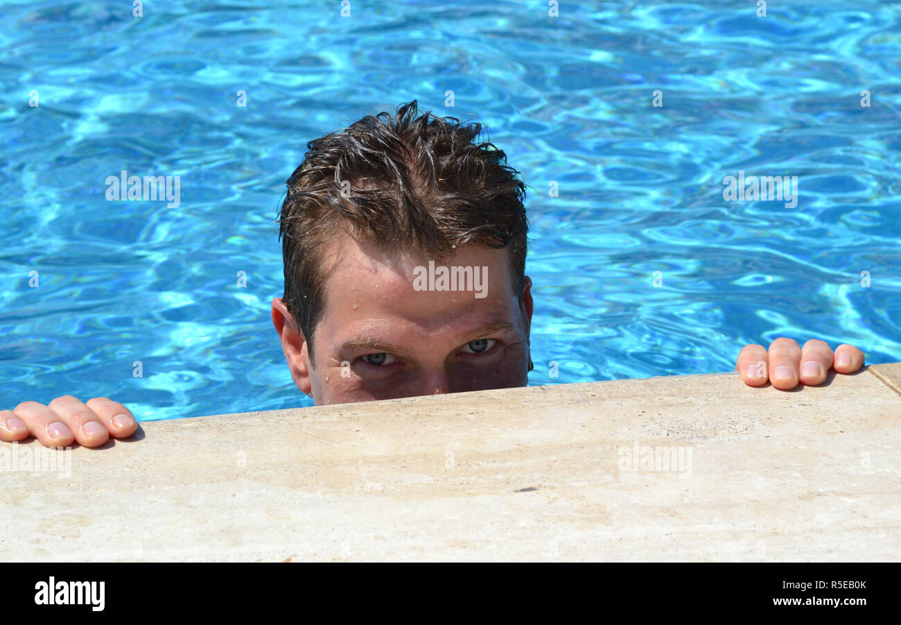 Handsome Caucasian man in the pool Stock Photo - Alamy