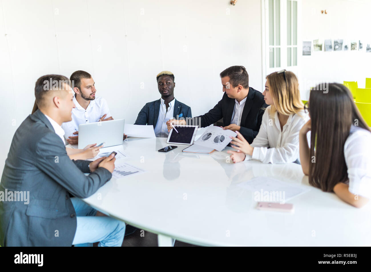 Business people team at meeting working documents together in office ...