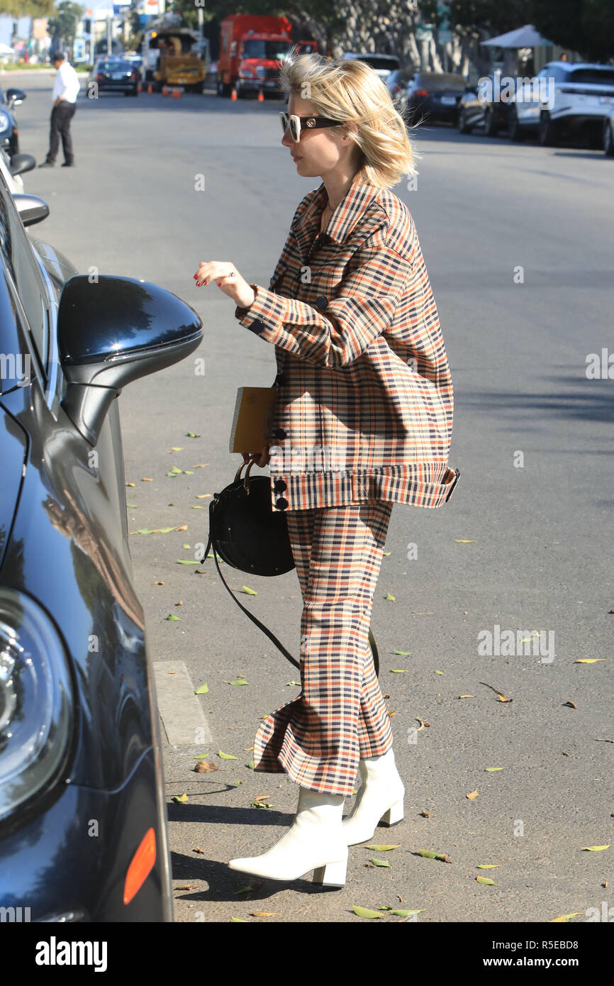 Emma Roberts steps out in a plaid suit and go-go boots Featuring: Emma ...