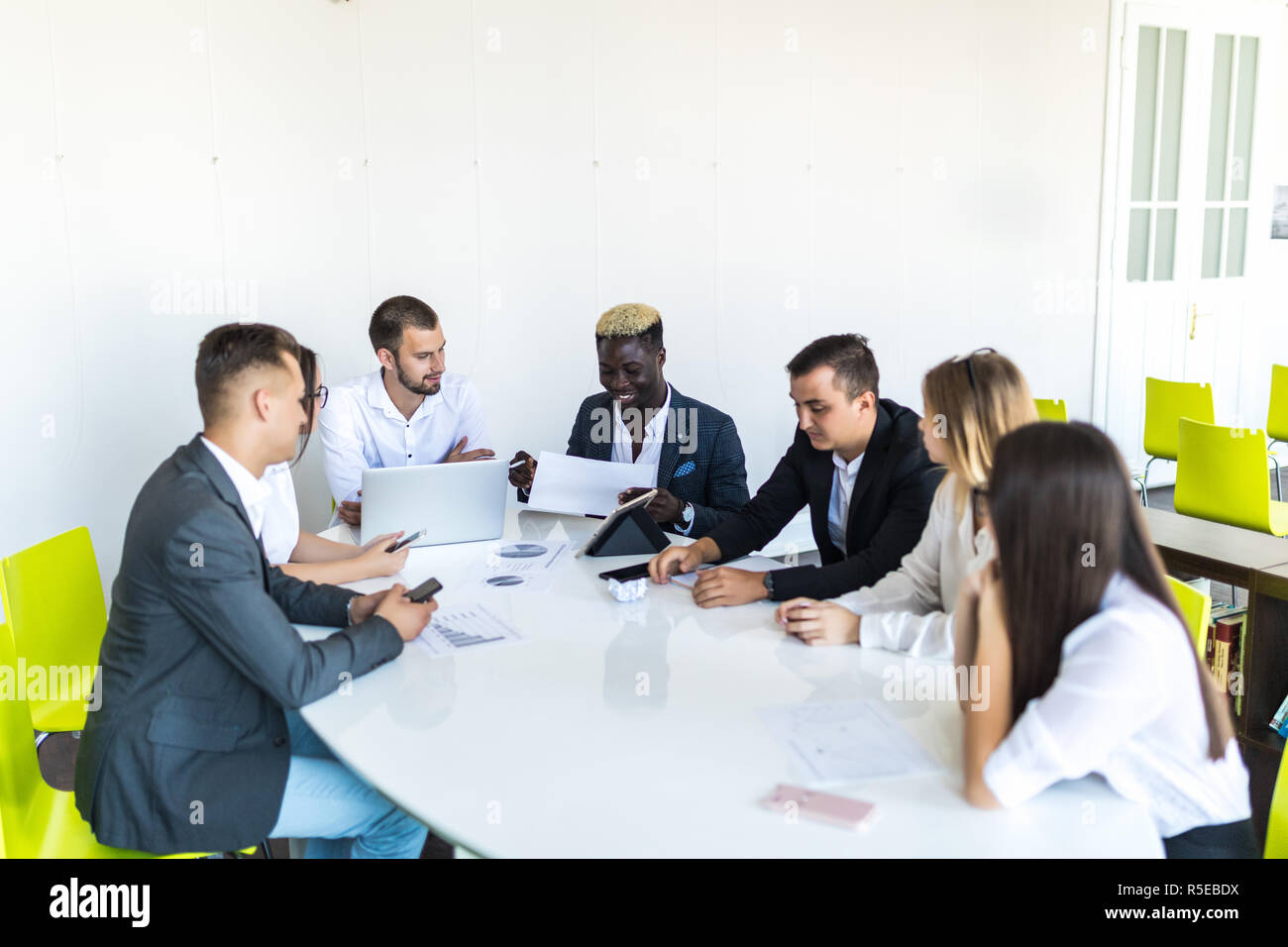 Business people discussing the charts and graphs showing the results of ...