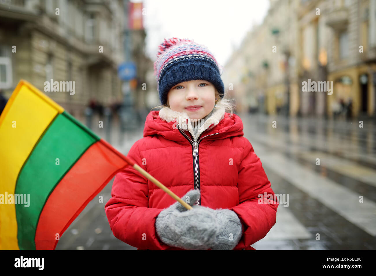 Cute little girl celebrating Lithuanian Independence Day holding ...