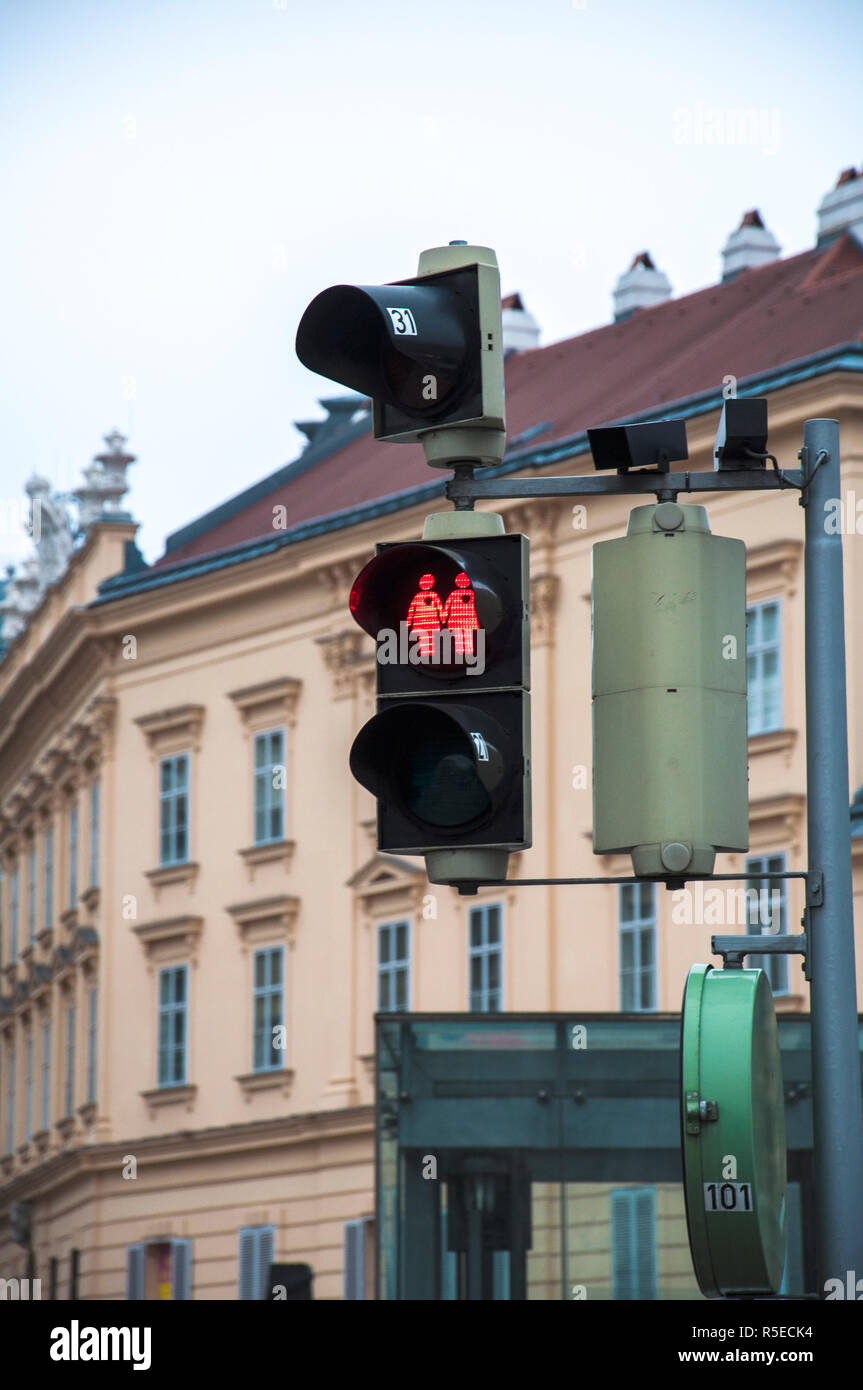 Traffic stop sign showing a female couple holding hands in Austria ...