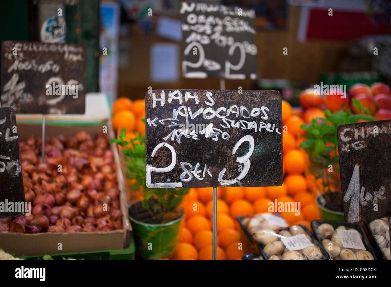 Baskets of vegetables and fruits with price tag for sale on a market ...