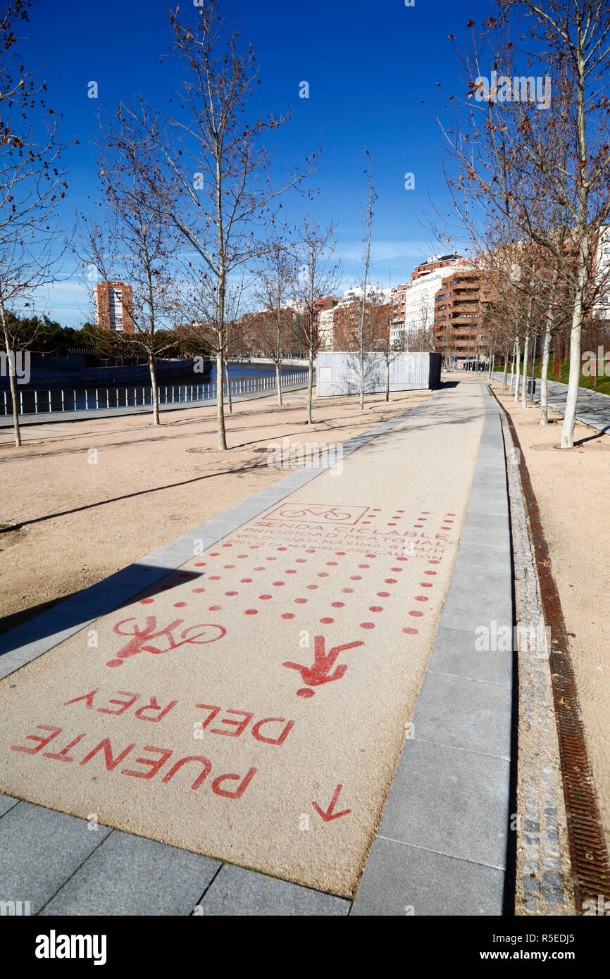 Cycle path with pedestrian priority next to Manzanares River the ...
