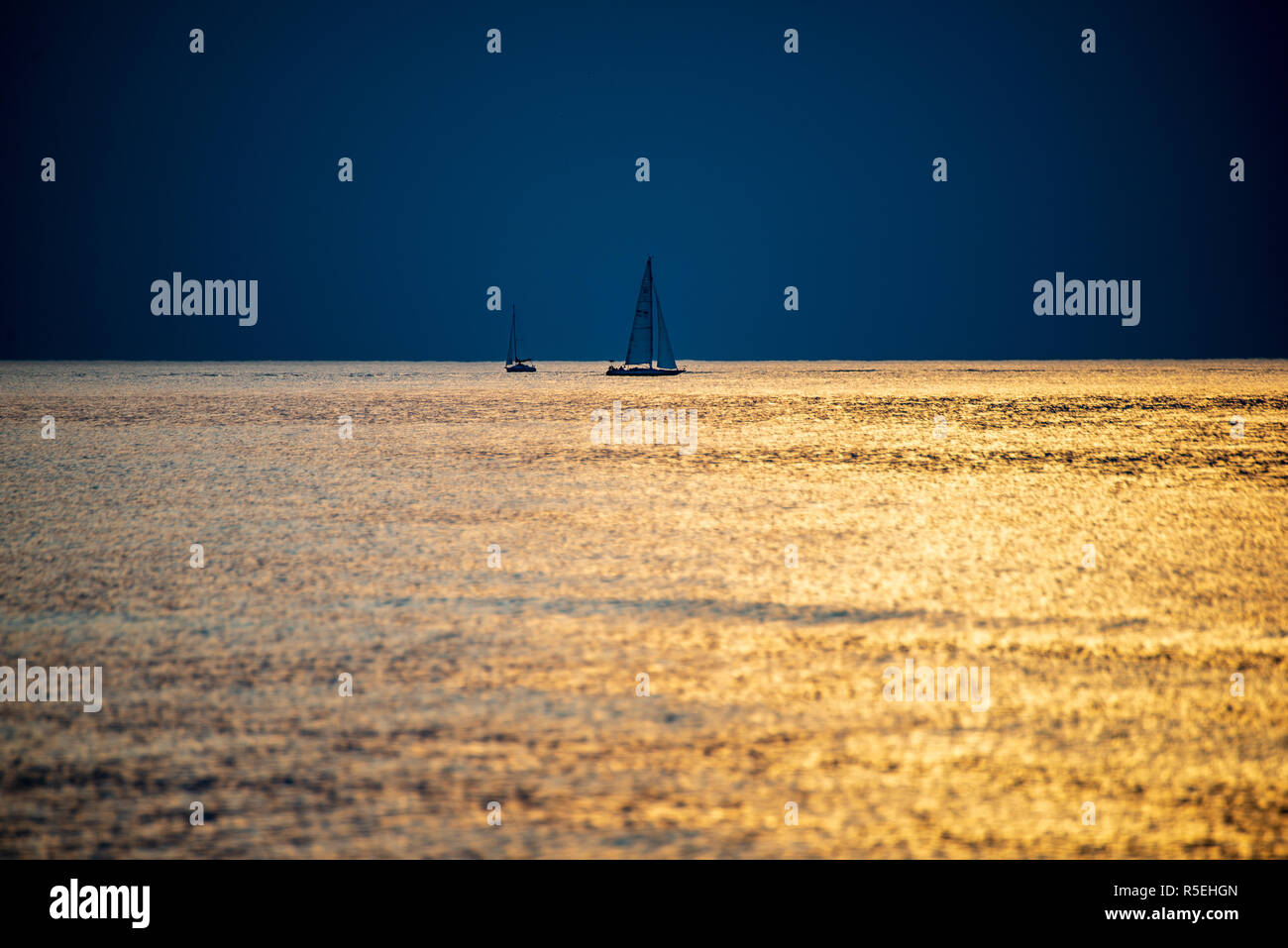 calm blue sunset over clear water in baltic sea. minimalistic image ...
