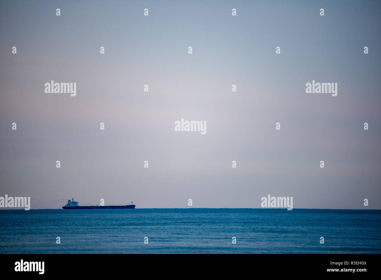 calm blue sunset over clear water in baltic sea. minimalistic image ...