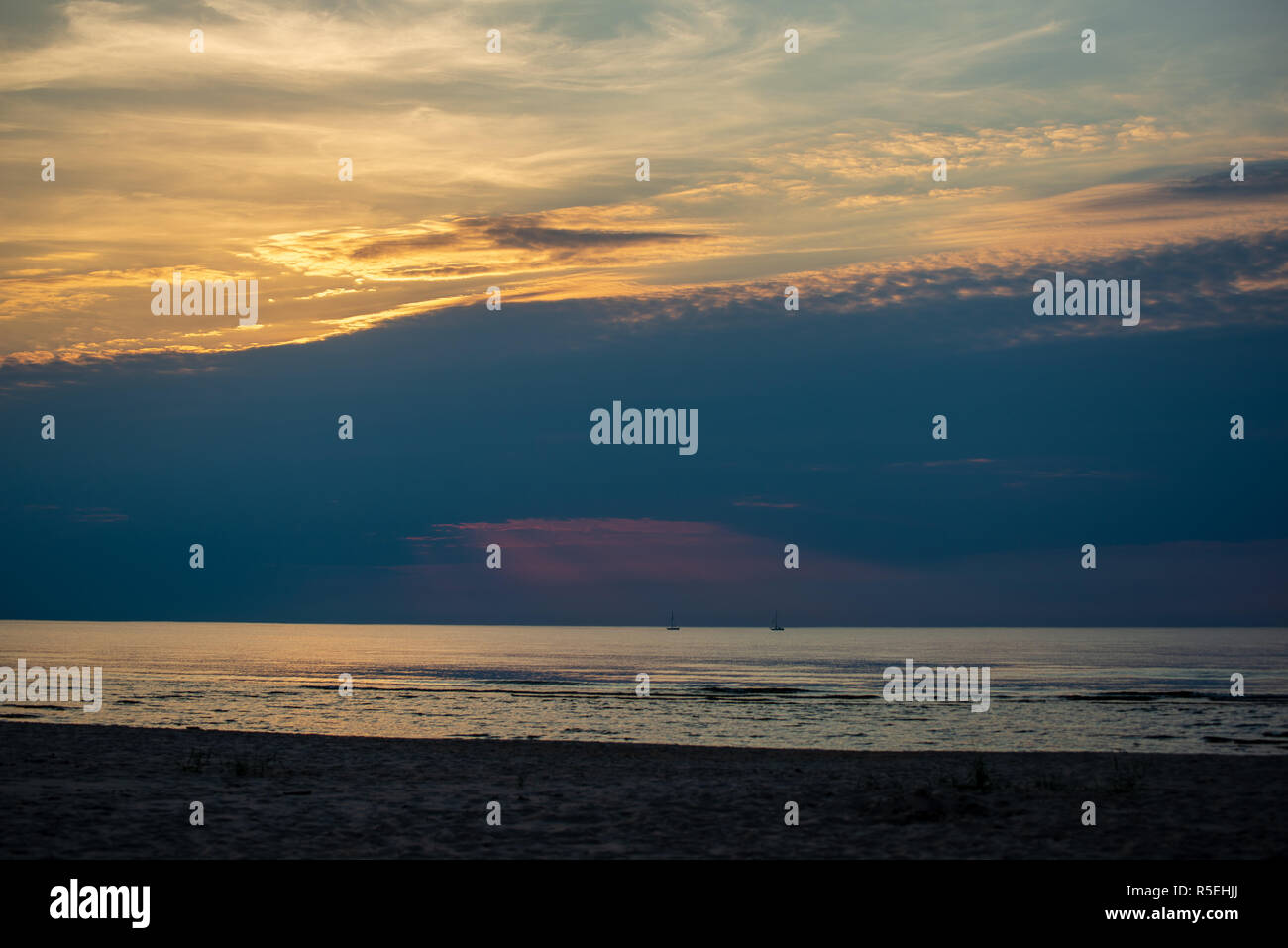 calm blue sunset over clear water in baltic sea. minimalistic image ...