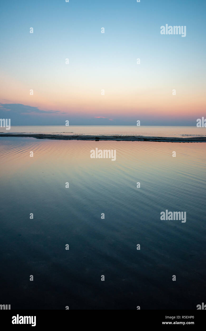calm blue sunset over clear water in baltic sea. minimalistic image ...