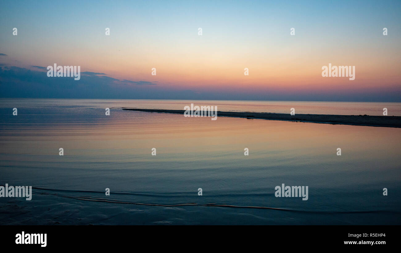 calm blue sunset over clear water in baltic sea. minimalistic image ...