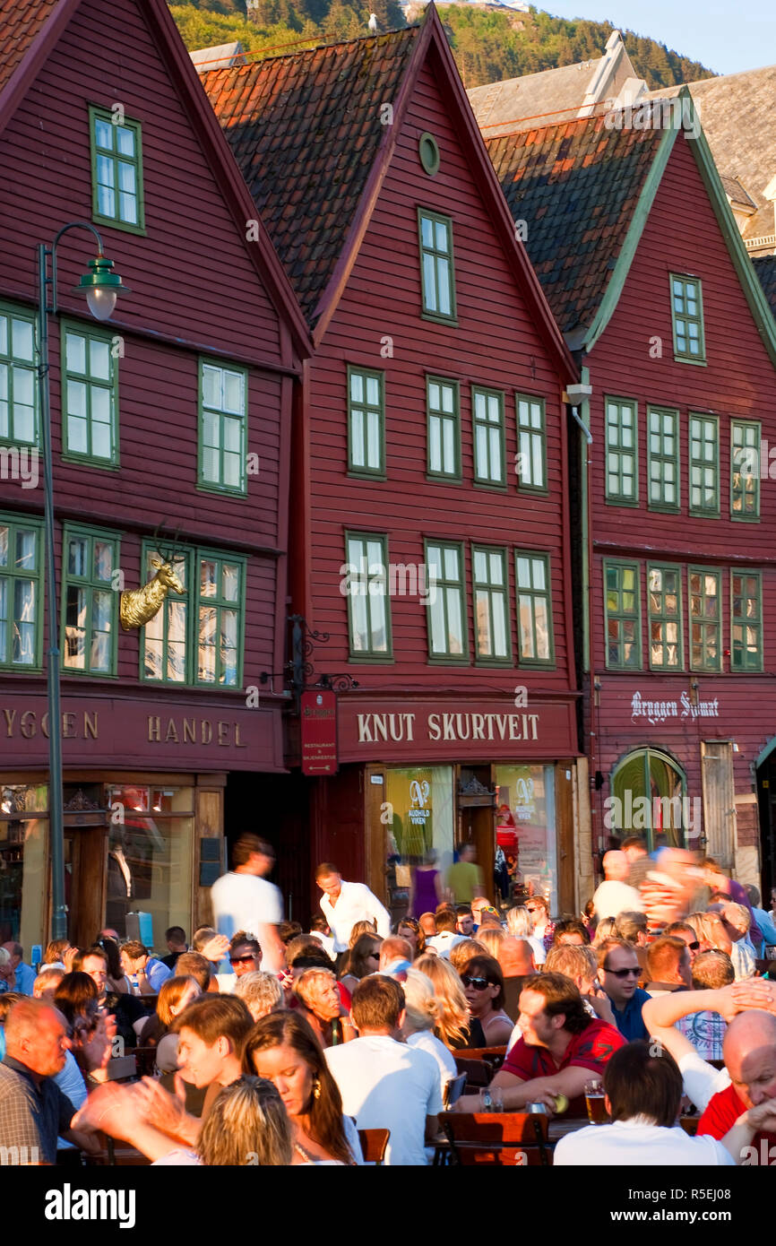 People sat at pavement bars/cafes, Bryggen, the medieval quarter of ...