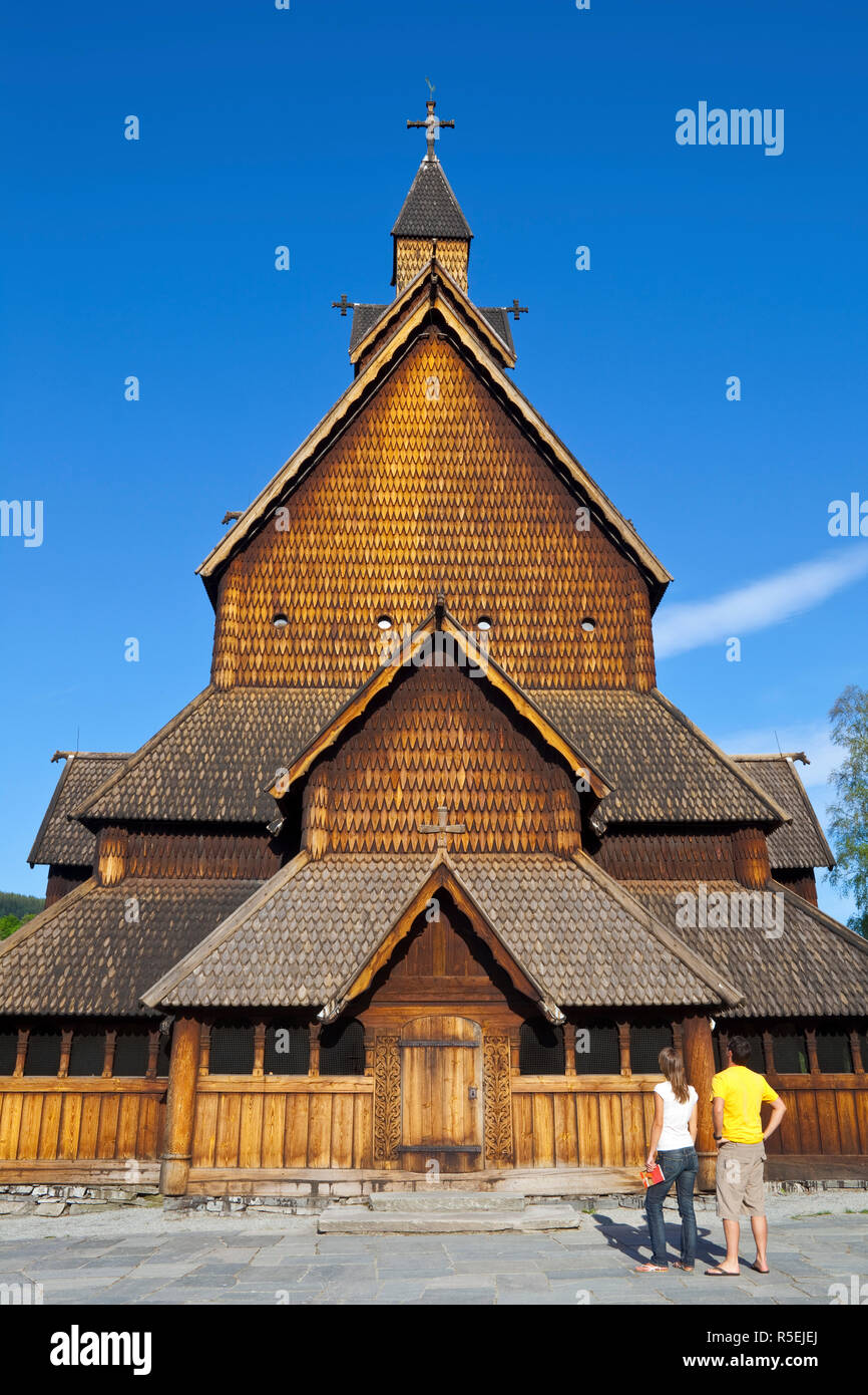 Young Couple take in the impressive exterior of Heddal Stave Church ...