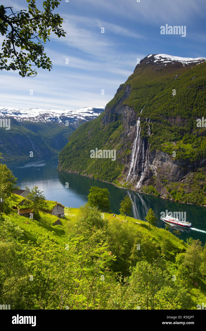 A car ferry passes beneath an old abandoned farm & the Seven Sisters ...