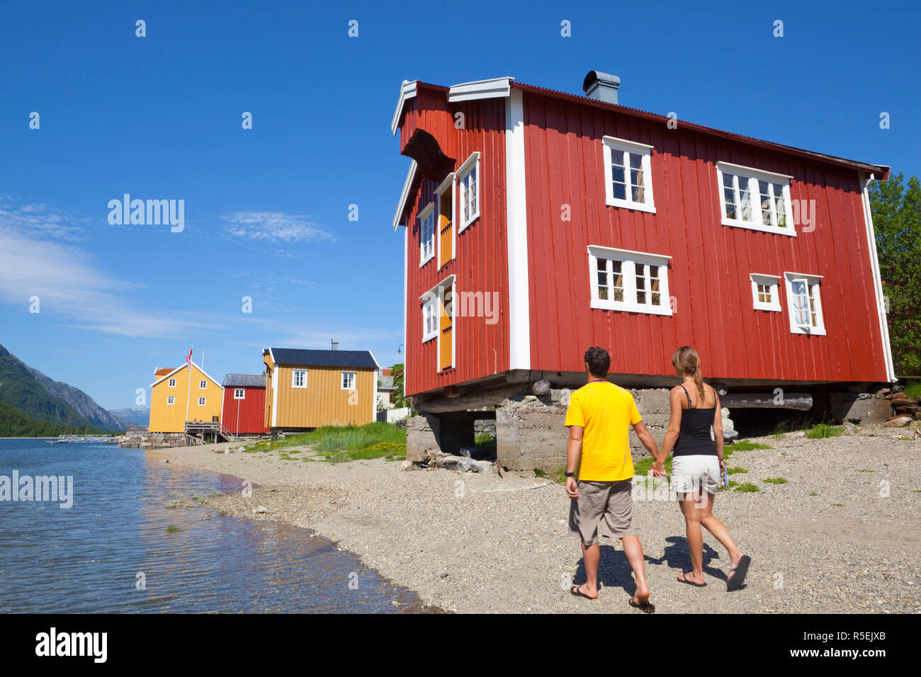 Toursits explore Mosjoen's colorful Fishing Warehouses, Mosjoen ...