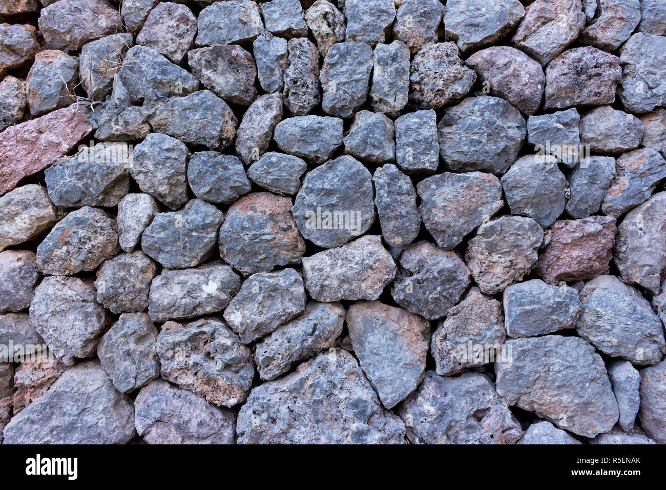 heavy blue grey stone rock wall Stock Photo - Alamy
