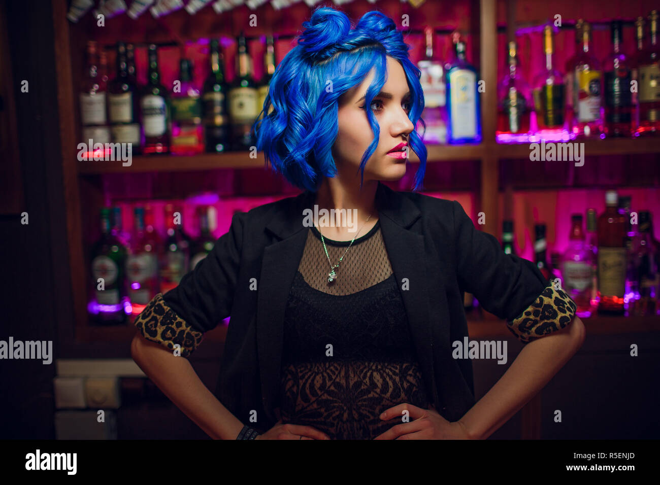 bartender girl with blue cocktail hair on background bar Stock Photo ...