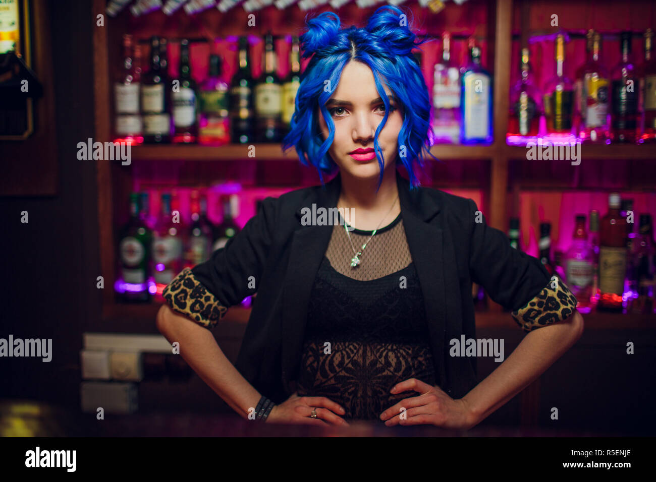 bartender girl with blue cocktail hair on background bar Stock Photo ...