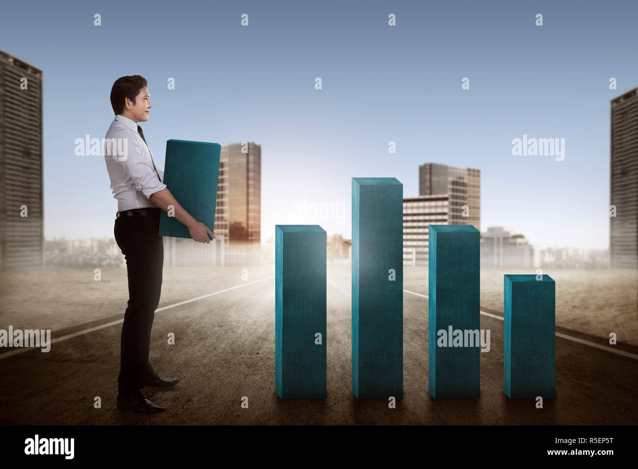 Asian business man carry heavy chart bar Stock Photo - Alamy