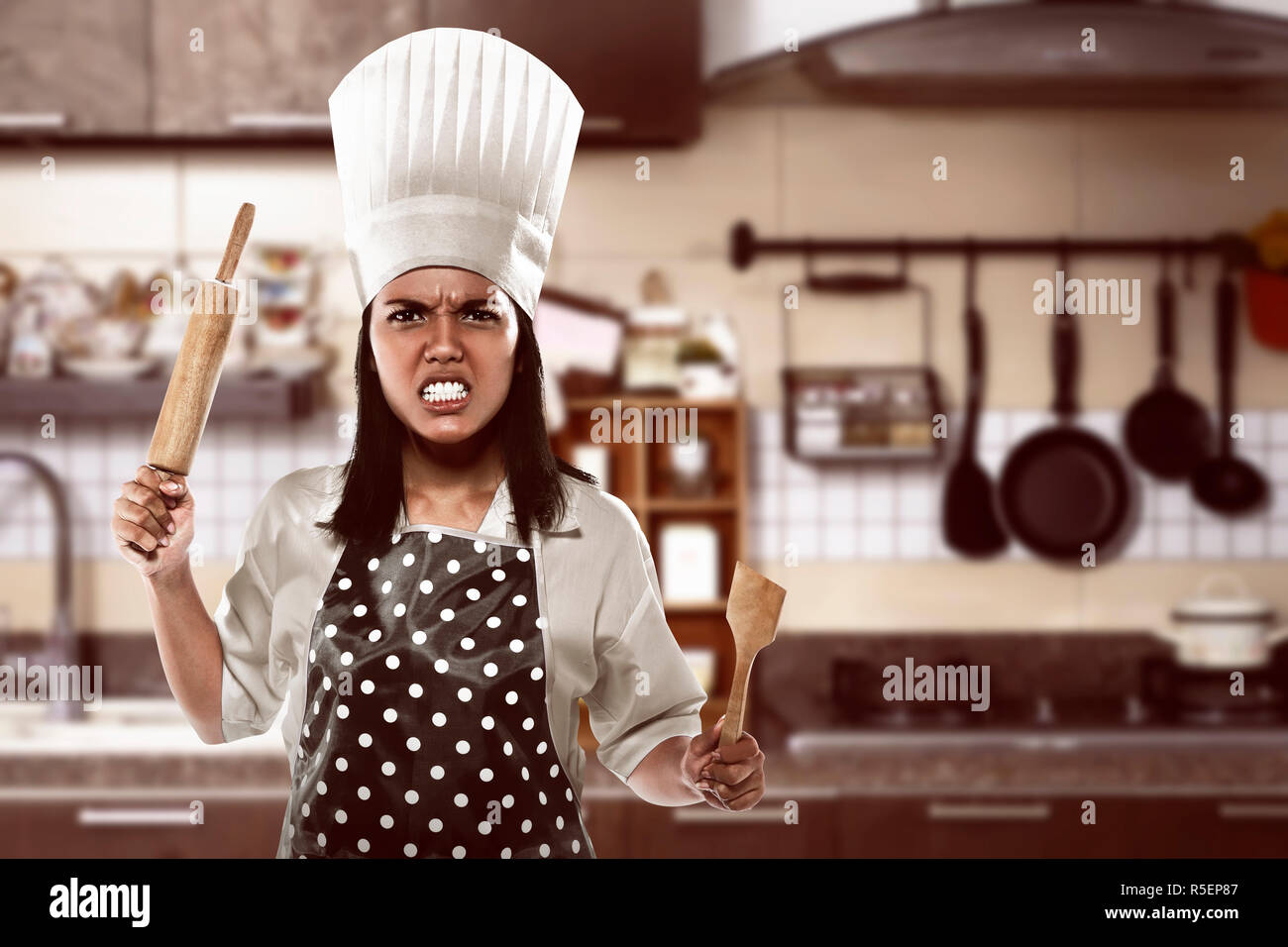 Angry female cook uniform hi-res stock photography and images - Alamy