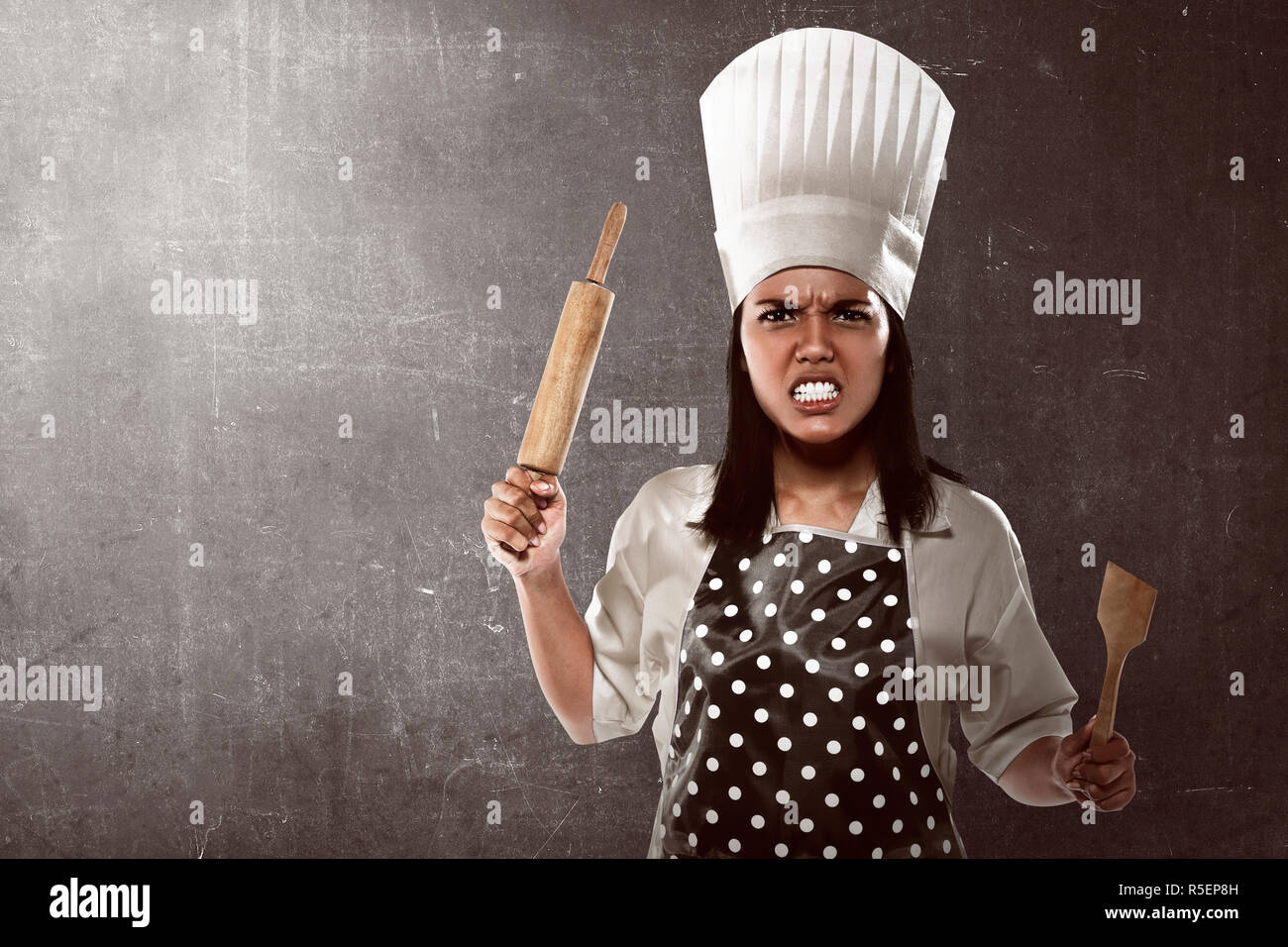 Angry asian woman chef Stock Photo - Alamy