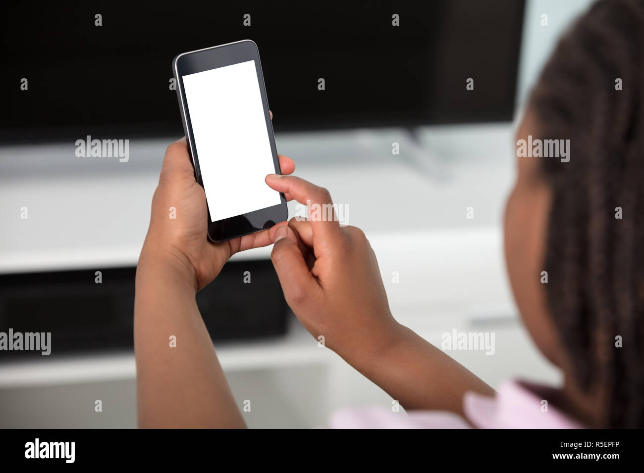 Child hand touching mobile phone hi-res stock photography and images ...
