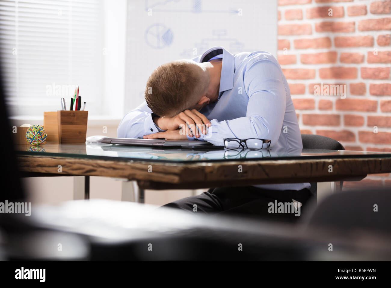 Office workers sleeping at desk hi-res stock photography and images - Alamy