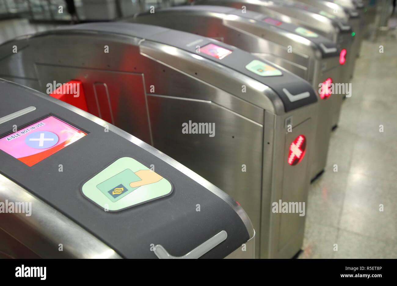 MRT Singapore subway ticketing gate. MRT is a rapid transit system ...