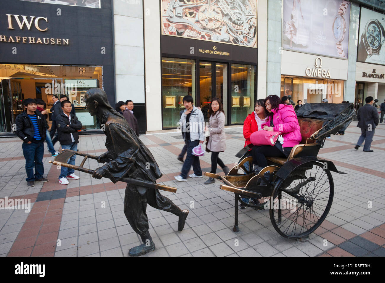 China, Beijing, Wangfujing Street, Sculpture of Man Pulling Rickshaw ...